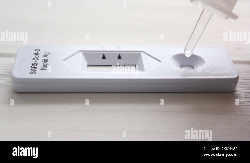 Testing for Covid-19 at home with rapid test kit, self test kit Stock ...