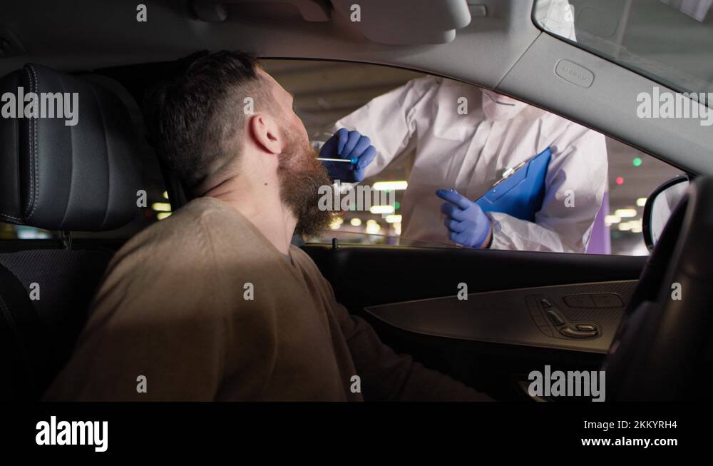 Video of driver during coronavirus drive-thru PCR test procedure Stock ...