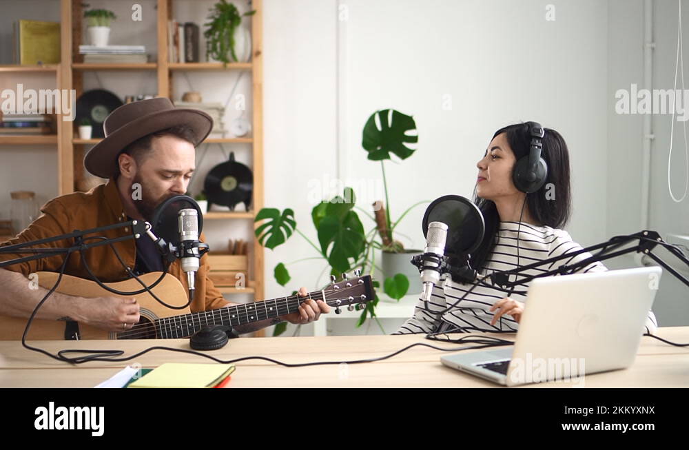 Man singer perform song at radio program while playing guitar, Spbd ...
