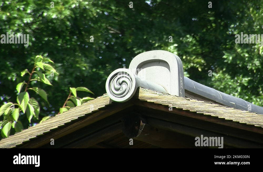 Roof tiles with a shinto spiral motif on a Japanese house Stock Video ...