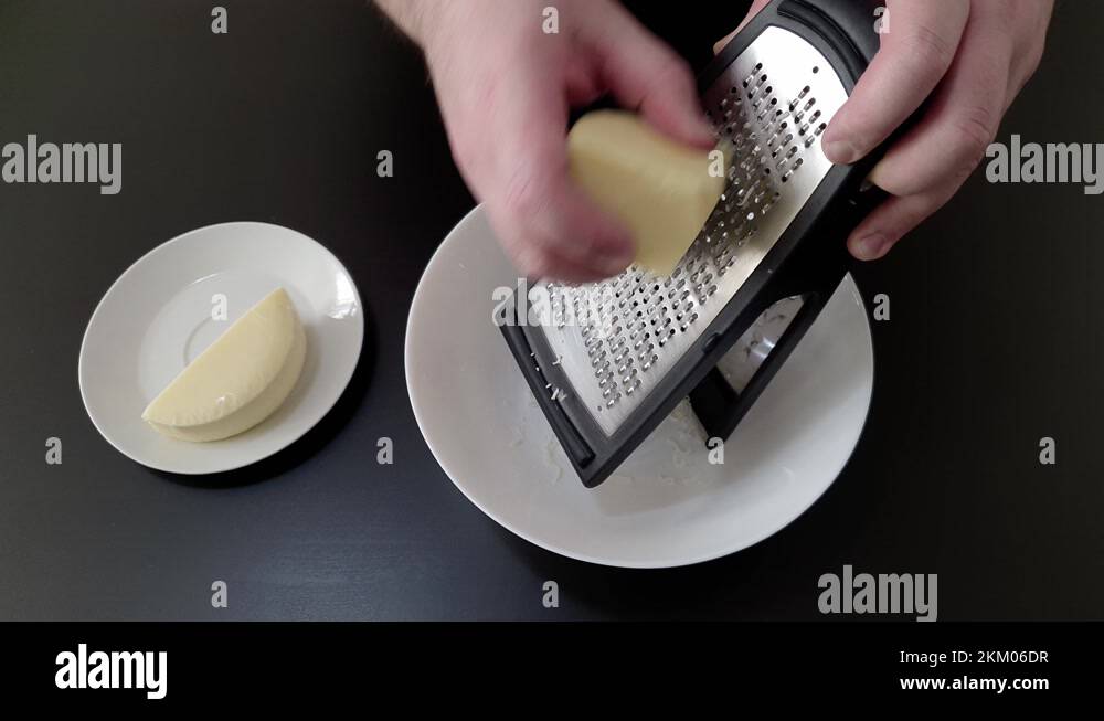Grating cheese grater hands Stock Videos & Footage - HD and 4K Video Clips - Alamy