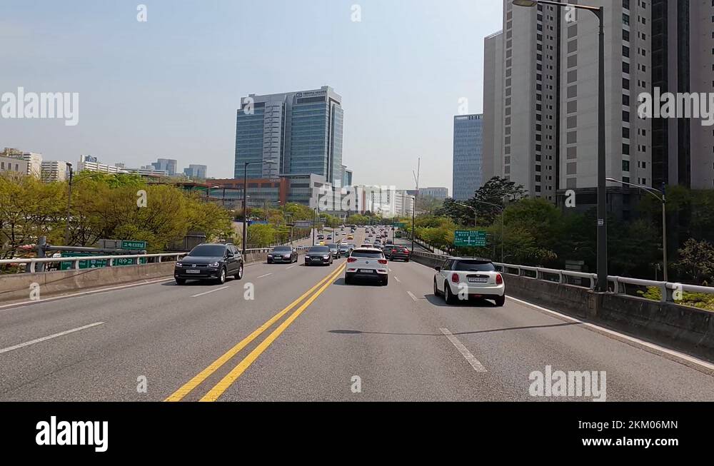 Traffic At City Road With Seoul Skyline At Daytime In Seoul, South ...