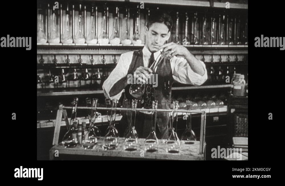 1940s: People at work in office. Men at work in lab. Men study map ...