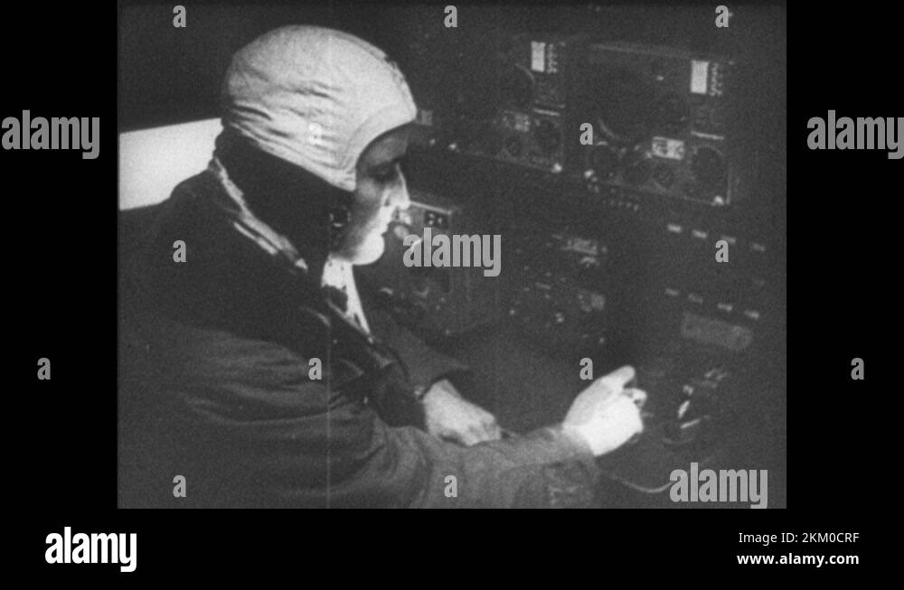 1940s: Pilot in cockpit, hands working controls. Man using telegraph in ...