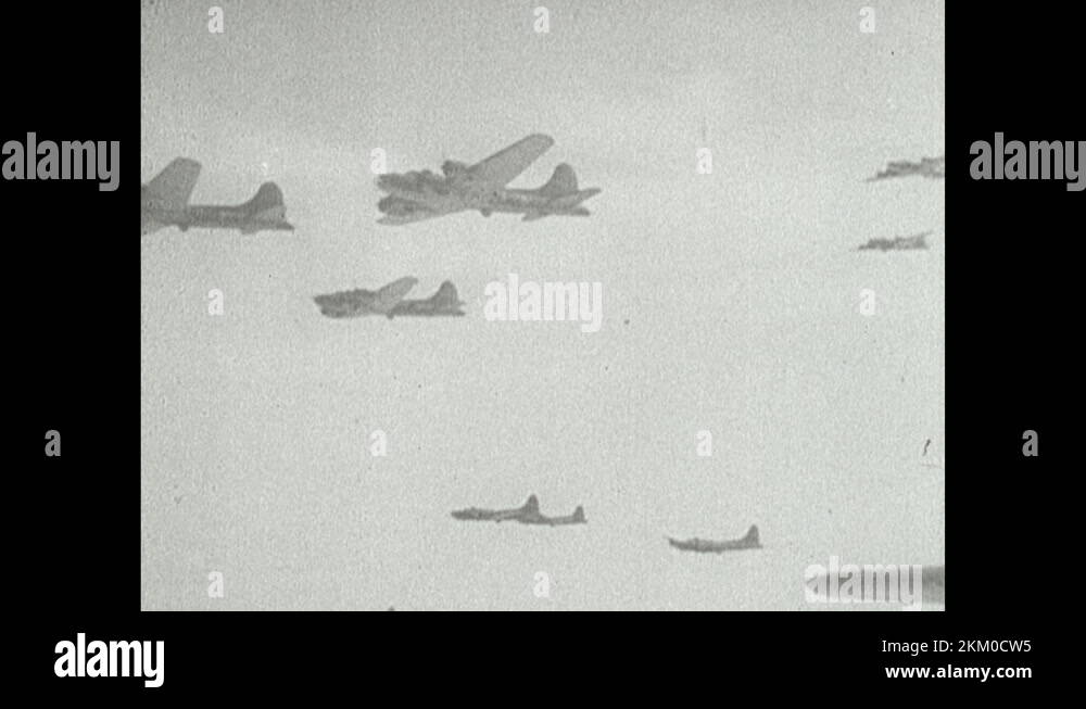 1940s: Intertitle card. Planes fly across sky. Soldiers with guns wait ...