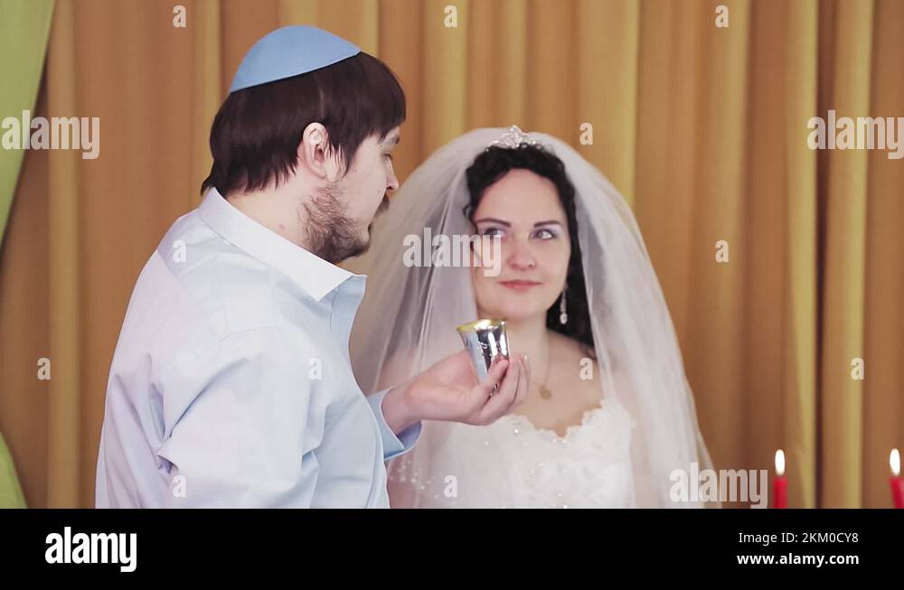 During the chuppah ceremony, the Jewish bride and groom in the ...