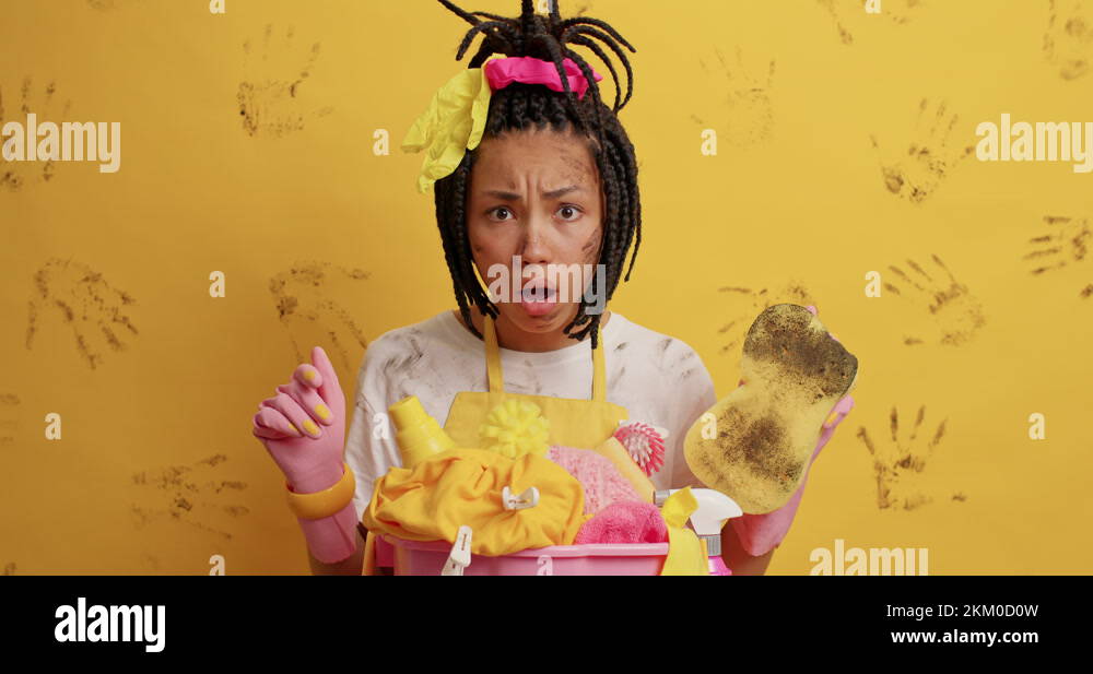 Embarrassed shocked untidy ethnic woman with combed dreadlocks says wow ...