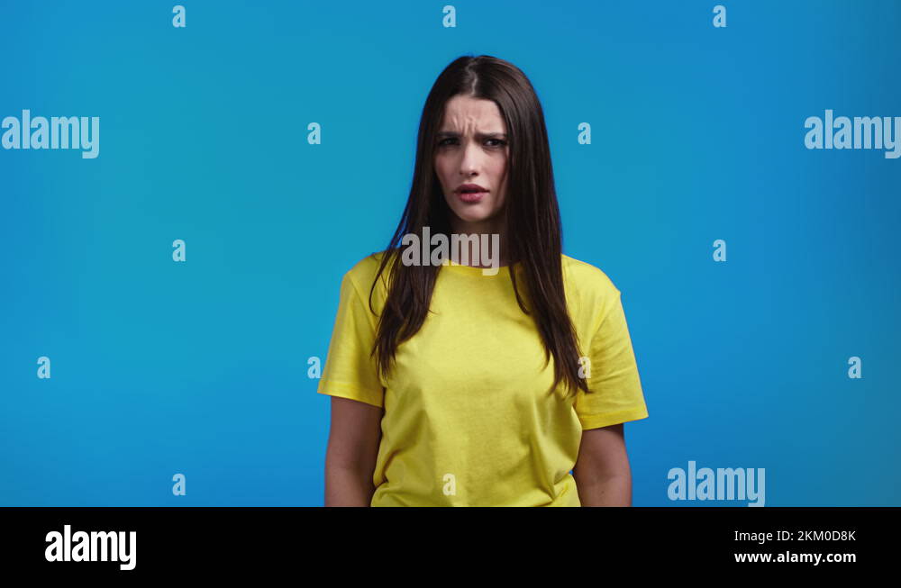 Inflexible woman with long hair disapproving with no head sign, nods ...