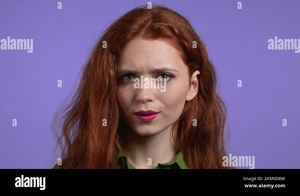 Inflexible woman with red hair disapproving with no head sign, nods ...