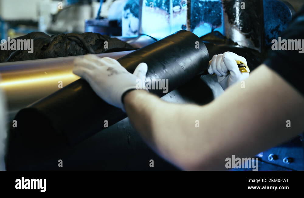 Worker cut rubber sheet from industrial roller 4K Stock Video Footage ...