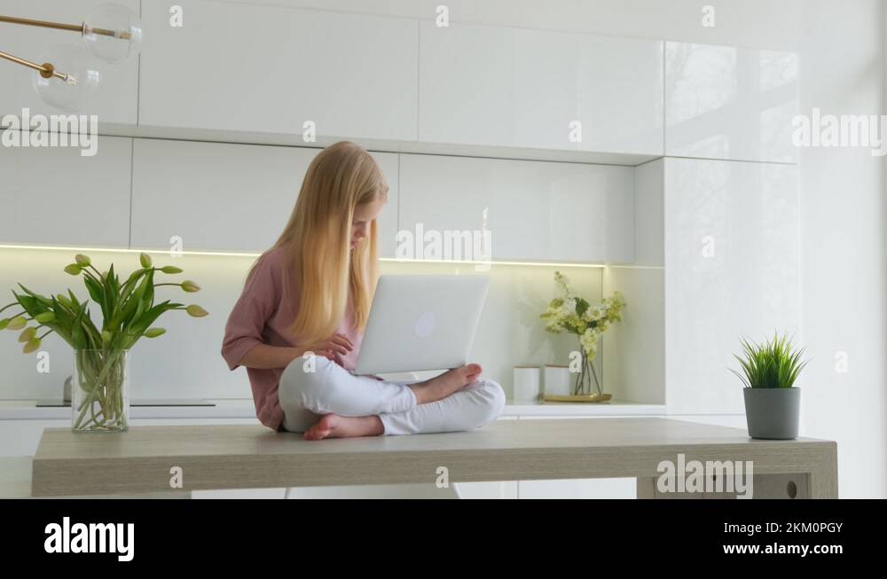 Girl sitting on desk Stock Videos & Footage - HD and 4K Video Clips - Alamy