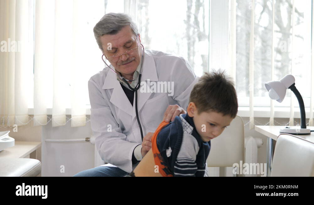 Professional pediatrician conducts medical examination Stock Videos ...