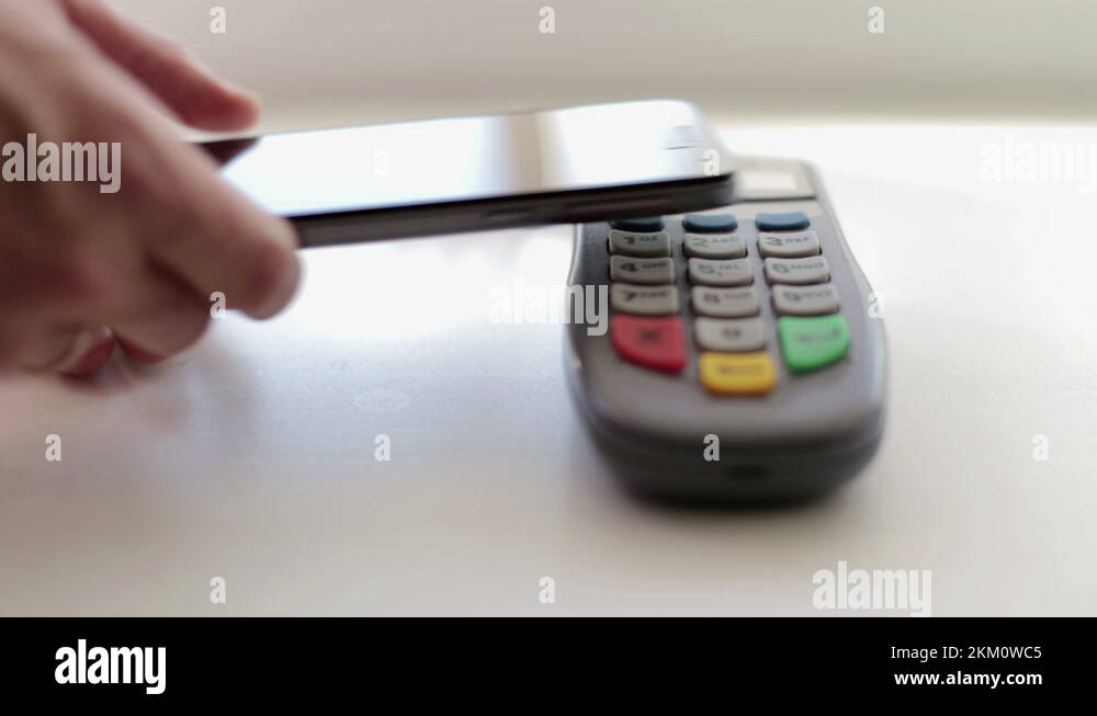 Pay using NFC contactless payment technology on a smartphone Stock ...