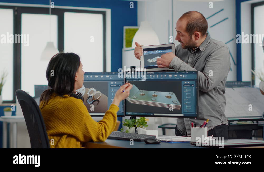 Team of architects and engineers working on building prototype project ...