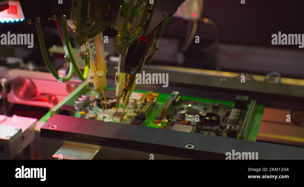 Industrial robot for electronics manufacturing makes a complex printed ...