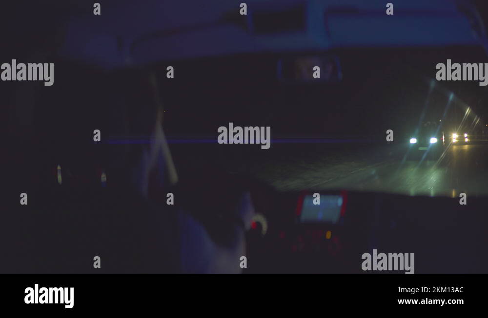 Man drive car in the city at night. Anamorphic lens shot Stock Video ...