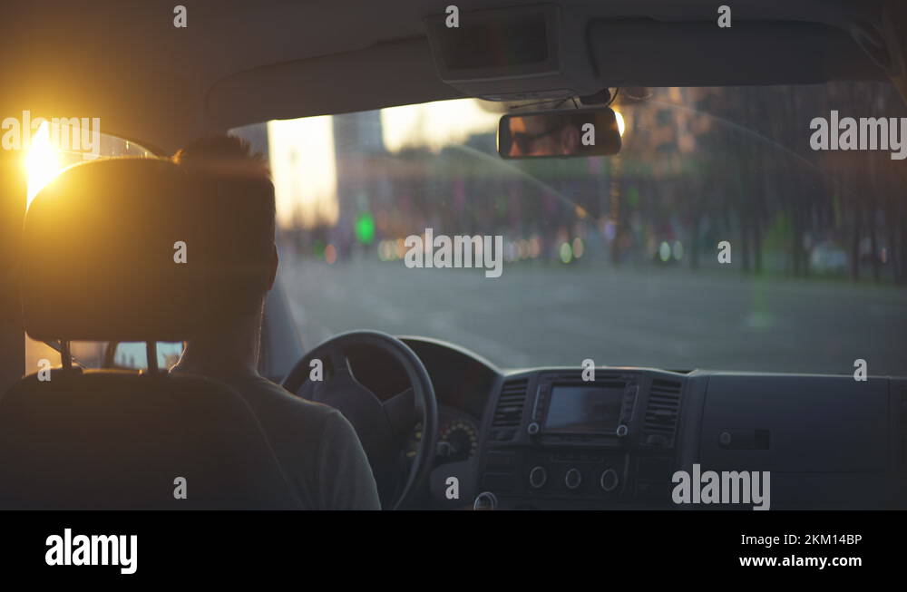 Man drive car by sunset background. Anamorphic lens shot Stock Video ...