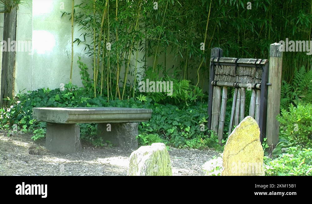 A bench and bamboo gate in a Japanese tea garden (roji-niwa Stock Video ...