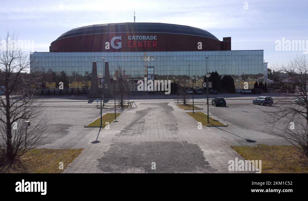 Ground level view zooming in at the Gatorade Center glass facade main ...