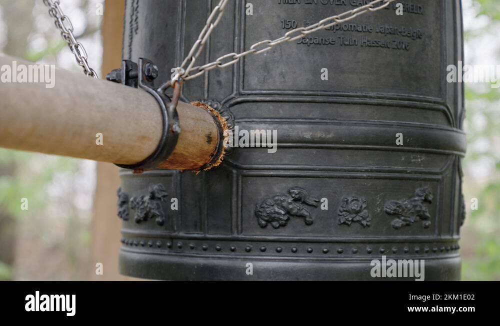Wooden round pile hits the peace bell in the largest Japanese garden of ...