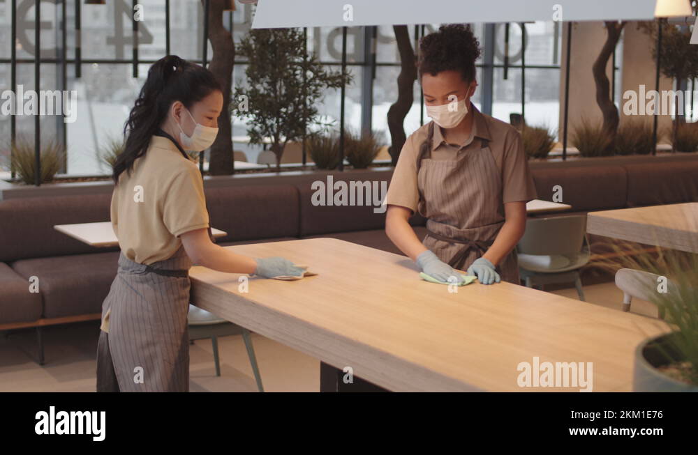 Women Cleaning Cafe Table Smiling Stock Video Footage - Alamy