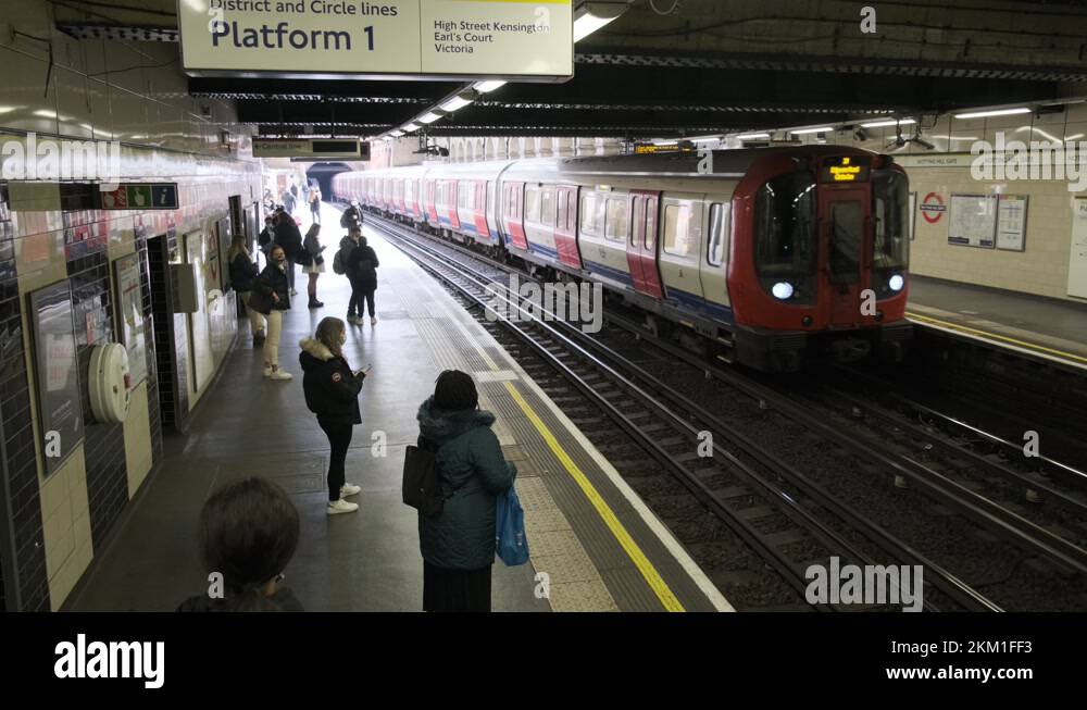 London District line underground train entering Notting hill gate tube ...