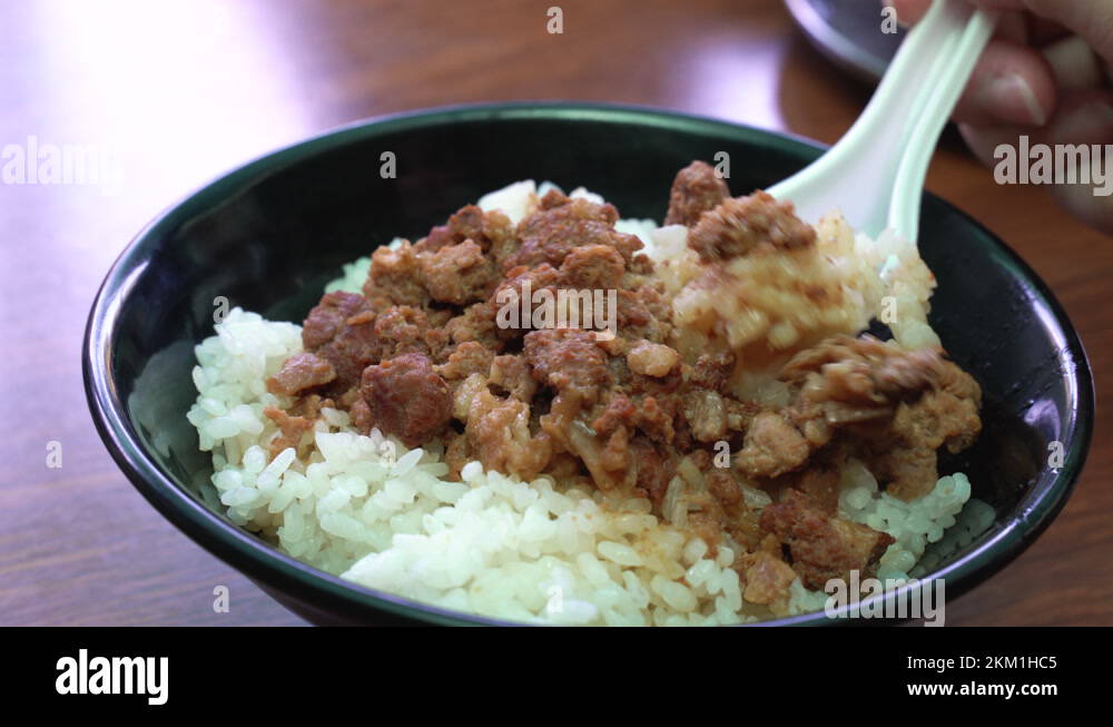 Braised meat over cooked rice, famous and delicious street food in ...