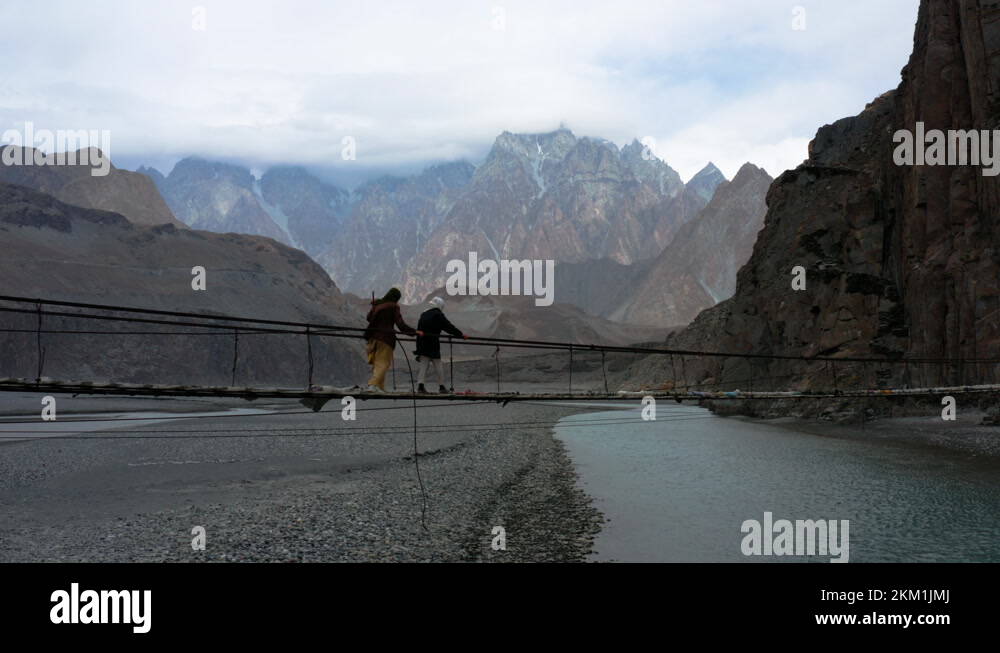 Local Women Crossing The Hussaini Hanging Bridge, Hunza, Gilgit ...