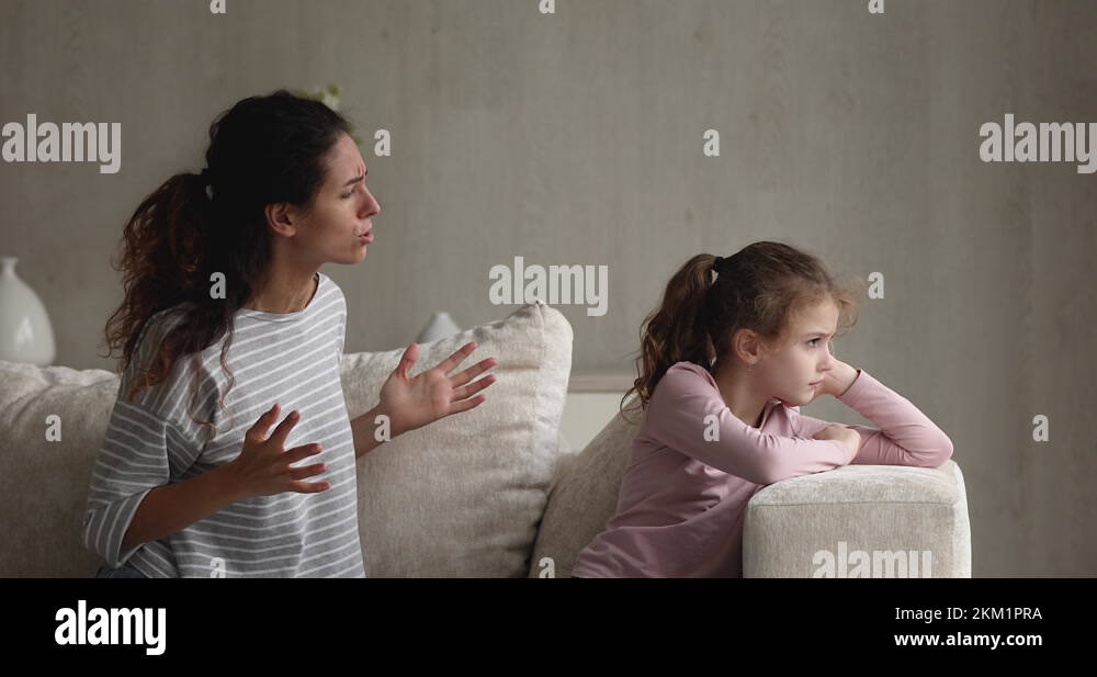 Irritated mother scolds preschool daughter for bad behavior and ...