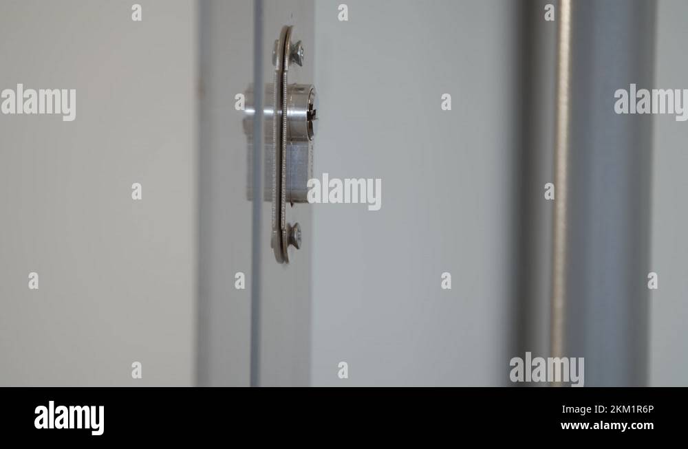 Closing the door with a key. Close-up of the door lock Stock Video ...