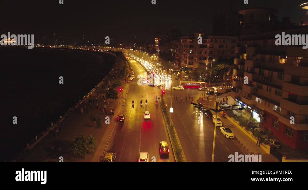 An aerial view with cinematic drone movement of the iconic Marine Drive ...