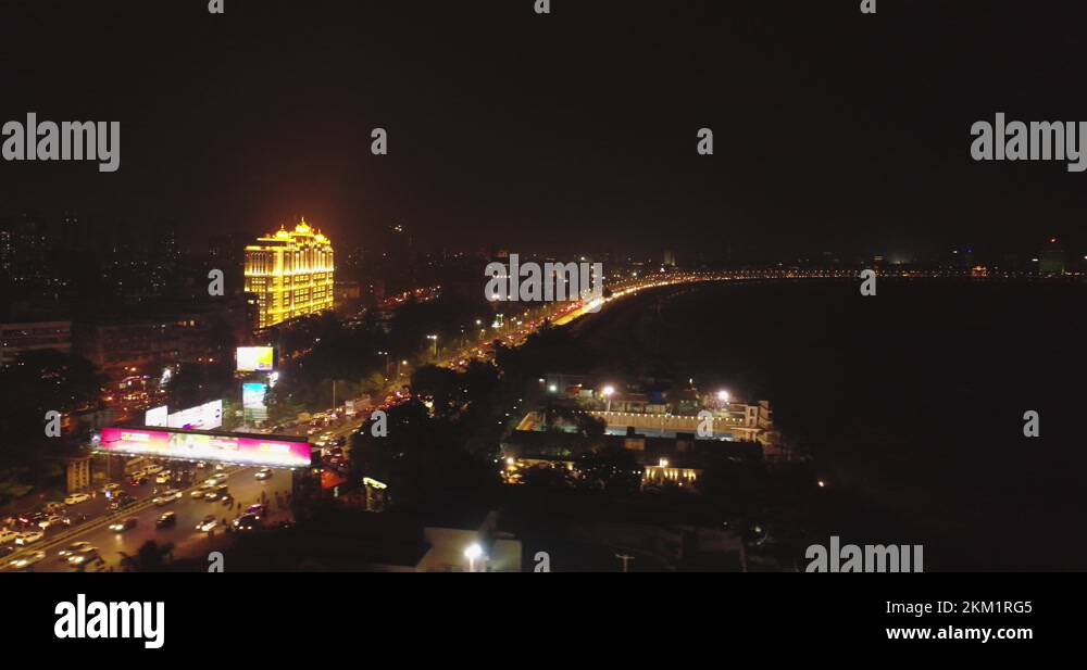 An aerial view with cinematic drone movement of the iconic Marine Drive ...