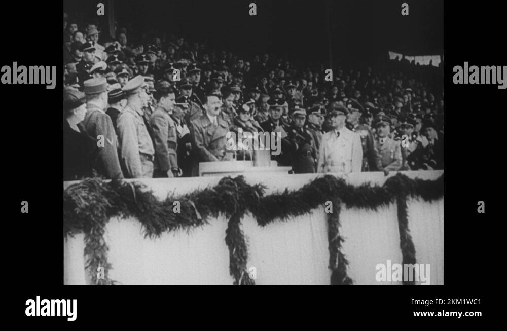 1930s German Officer Salutes Adolf Hitler In Stadium At Rally Hitler