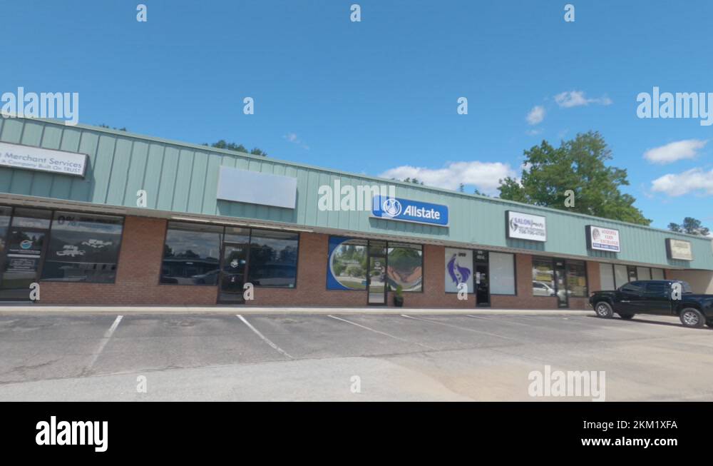 Corner pan of a vintage retro green tin roof shopping plaza retail ...