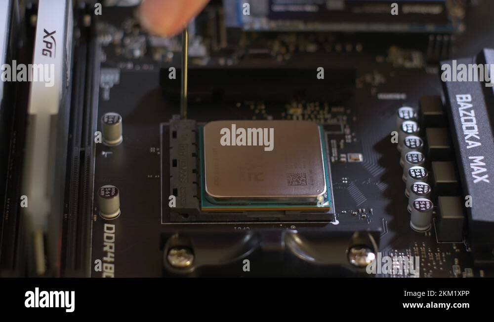 Installing a new Processor into the Motherboard for a Gaming PC build Stock Video Footage - Alamy