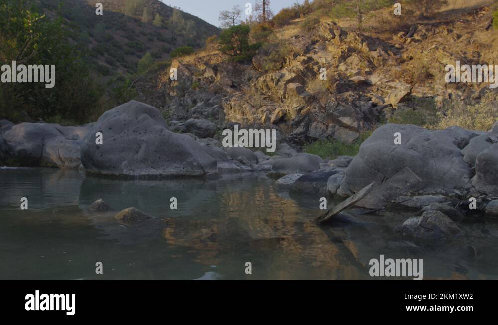 Stone sticking out from water Stock Videos & Footage - HD and 4K Video ...