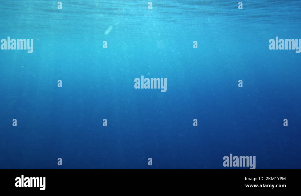 Ocean surface seen from underwater in 4K. Real-life sea scene view with ...