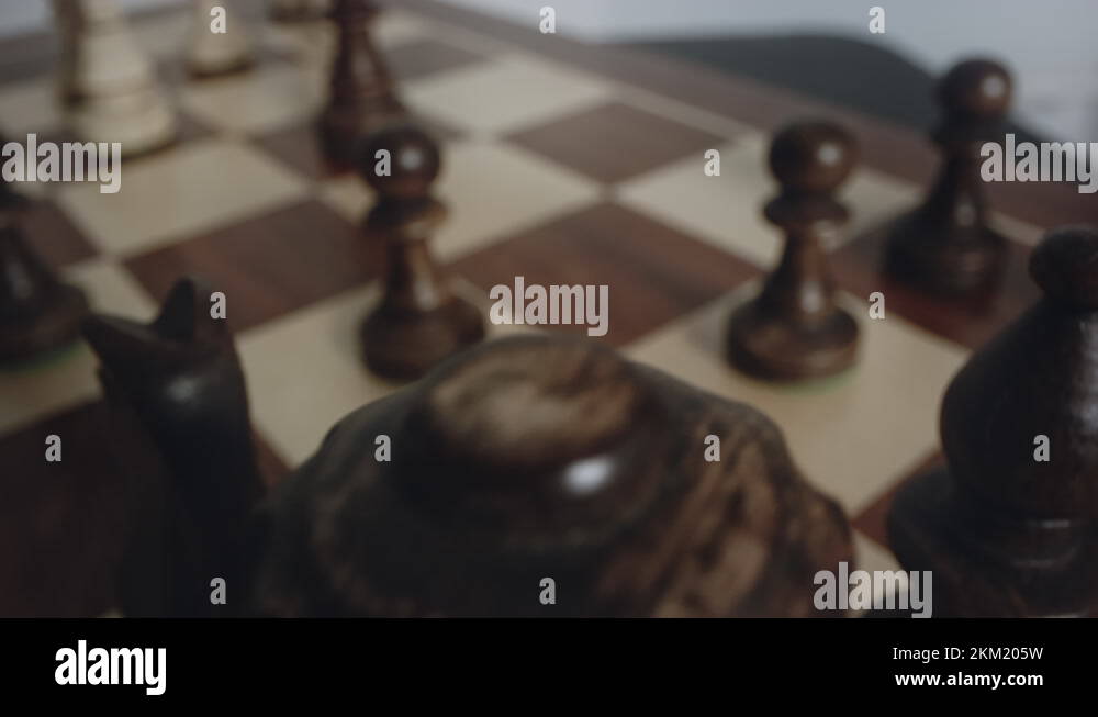 Rotating Chess Board as Black King and Queen Chess Pieces Come into ...