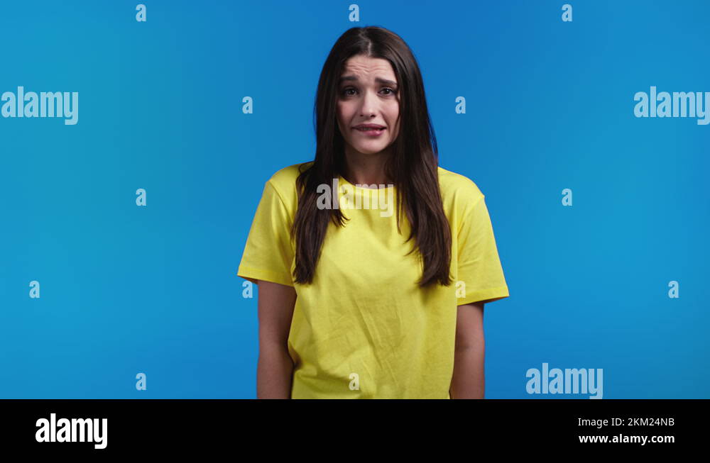 Guilty confused woman making oops, im sorry expression. Girl long hair ...