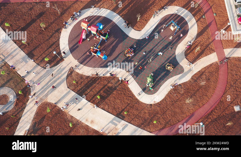 Playground for kids in a park bustling with activity, busy with ...