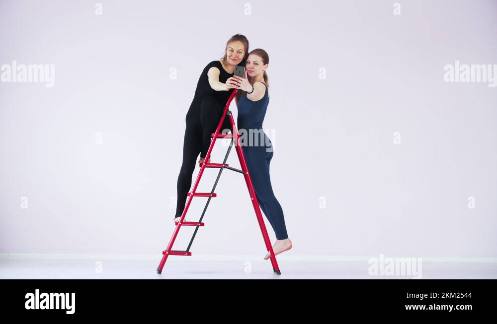 Women on ladder Stock Videos & Footage - HD and 4K Video Clips - Alamy
