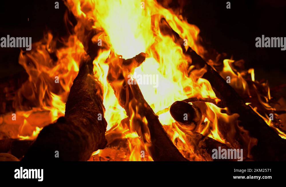 A pile of firewood burning, bringing light and warmth to dark and cold ...