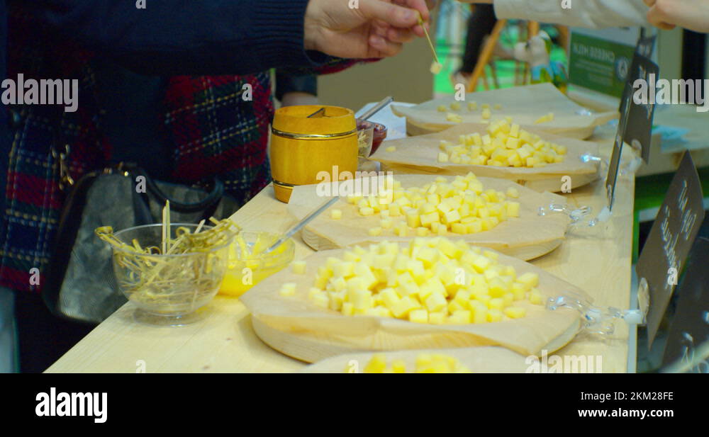 Food presentation. Cheese of different varieties lies into plates on ...