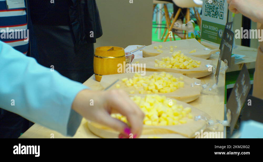 Food presentation. Cheese of different varieties lies into plates on ...