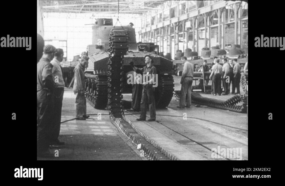 1940s: Track laid on floor of tank assembly line. Tank wheel on track ...
