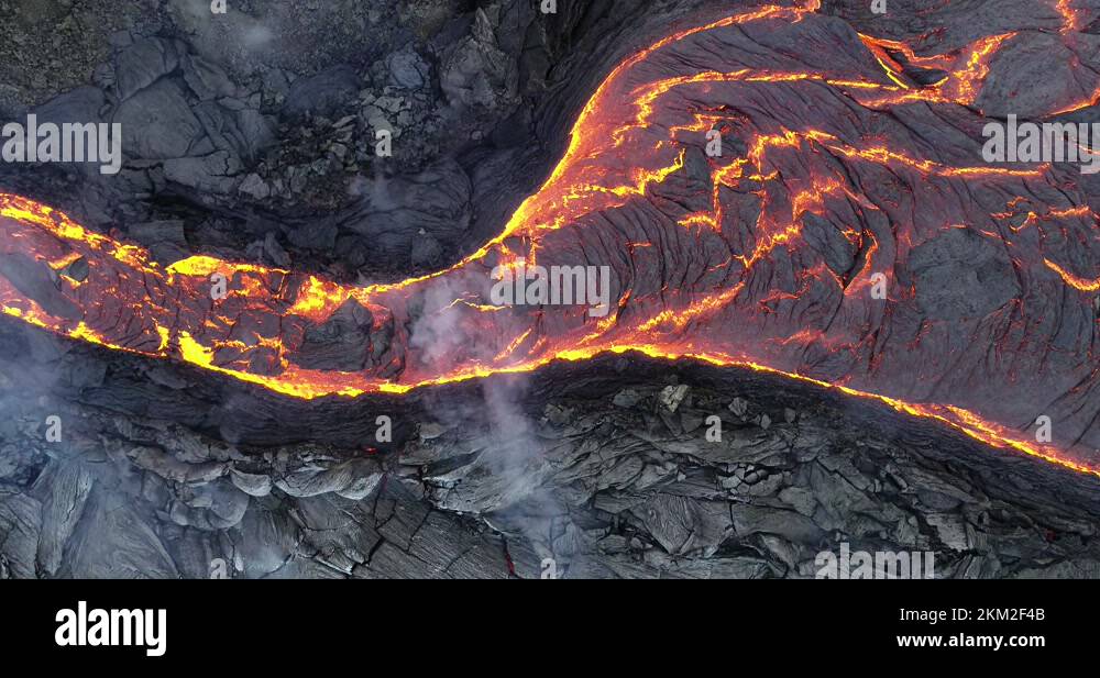 Lava flowing from active volcano from aerial view in 4k Dlog Stock ...