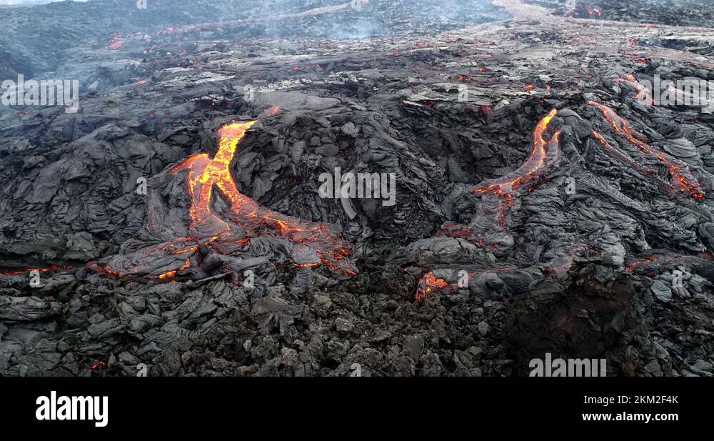 Lava flowing from active volcano from aerial view in 4k Dlog Stock ...