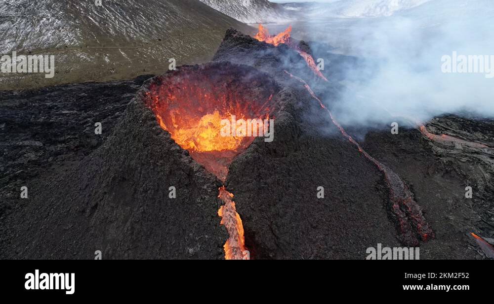 Lava flowing from active volcano from aerial view in 4k Dlog Stock ...