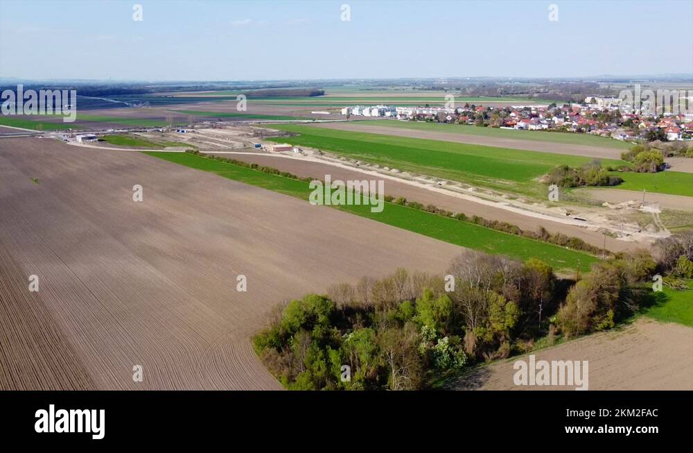 Construction site of a train line between fields, earth curvature ... Construction site of a train line between fields, earth curvature ...