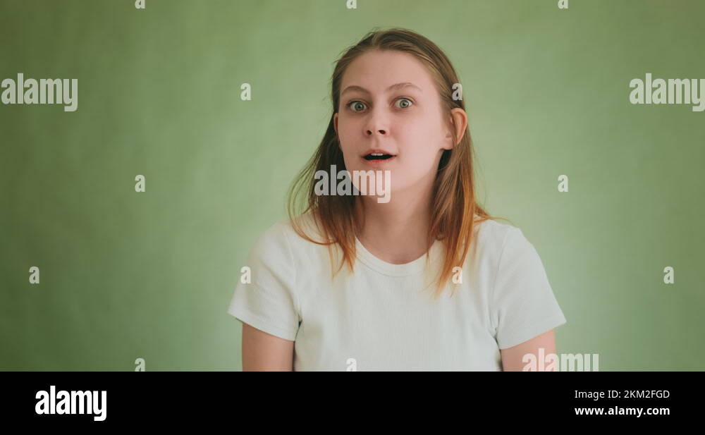 Shocked young woman becomes very angry posing for camera Stock Video ...